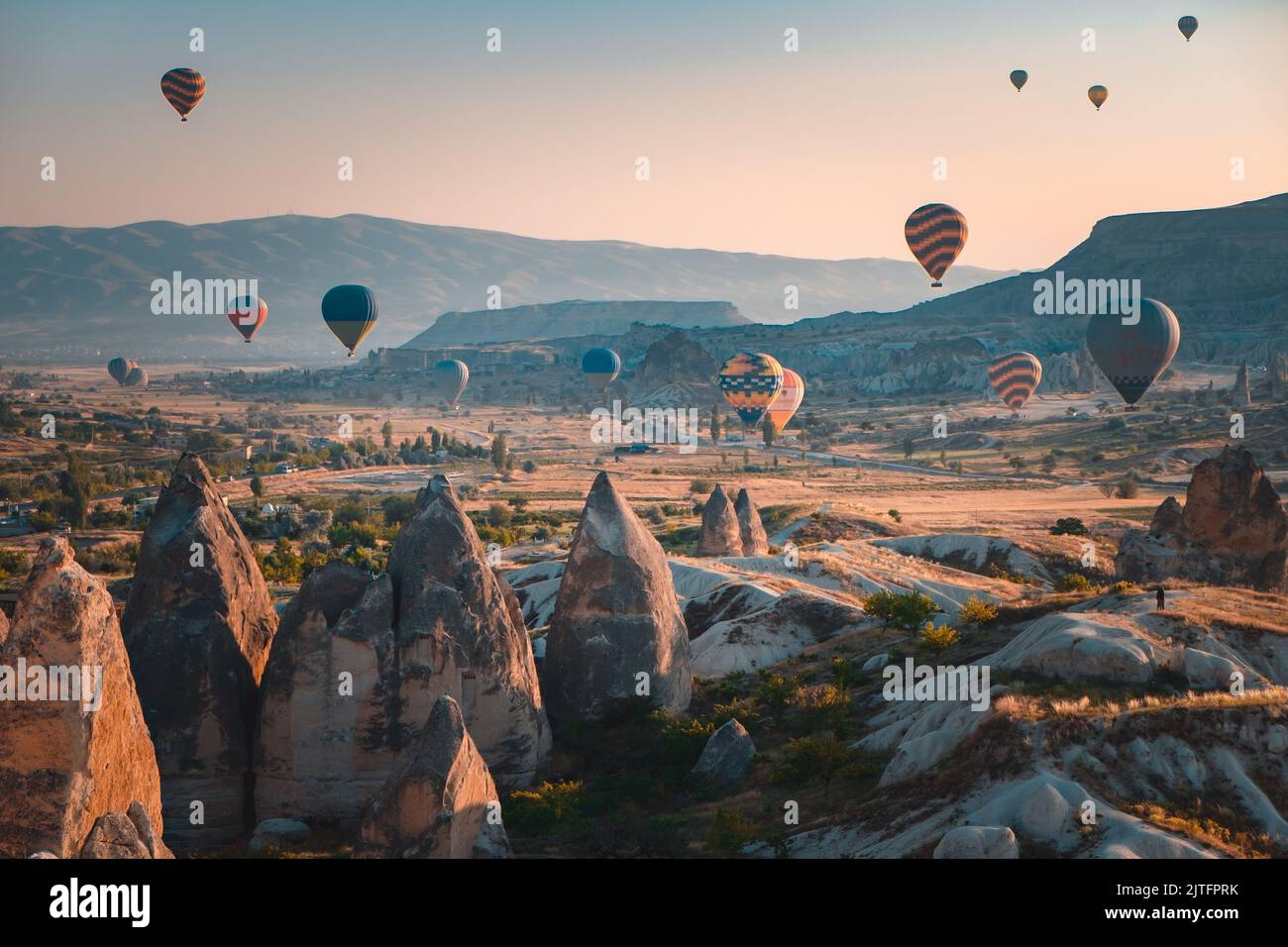 Cappadocia aerial sunrise landscape, colorful hot air balloons fly over ...