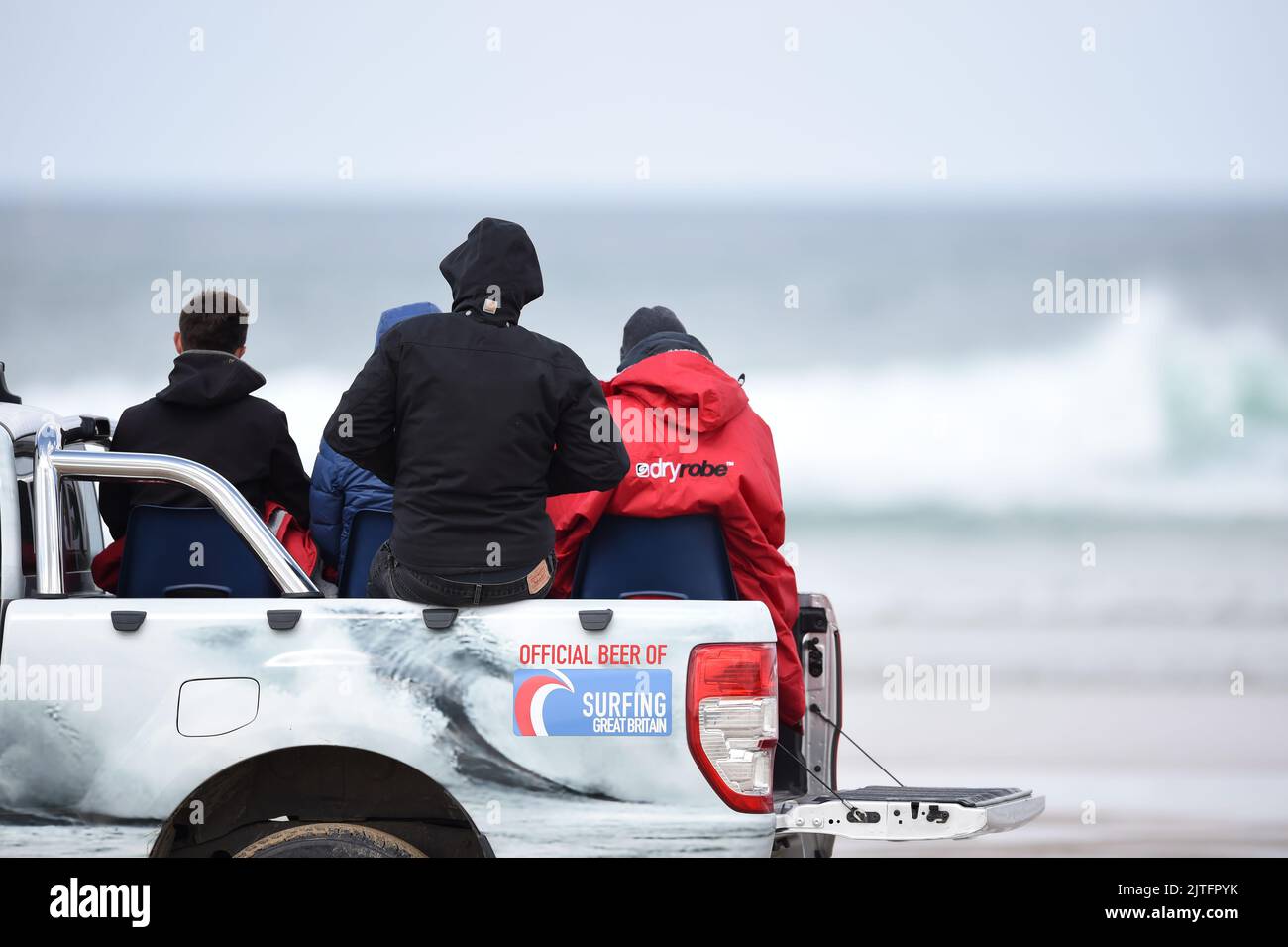 Judges in the back of a vehicle watching Surfing competition Stock ...