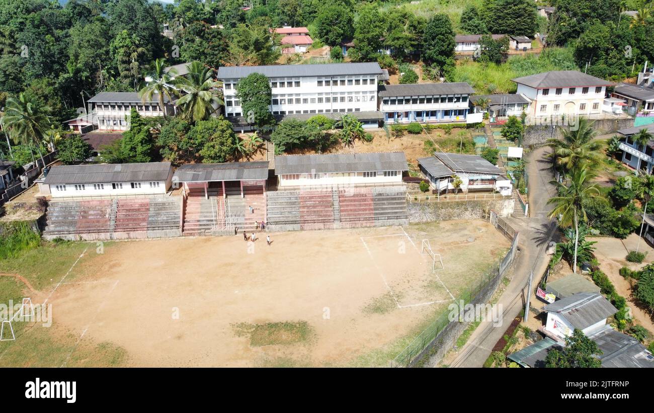 An aerial view of rural football field and country building on a sunny ...