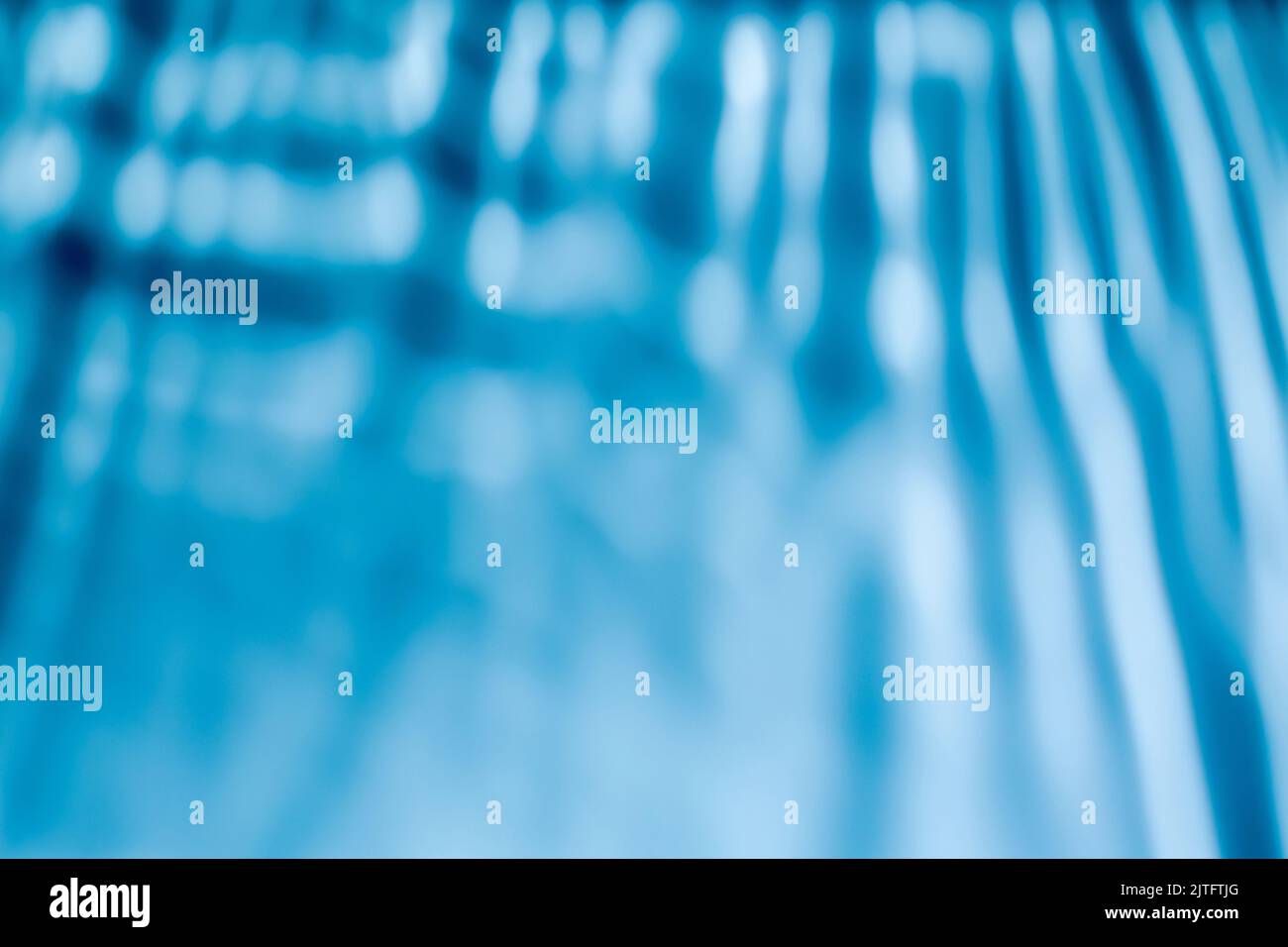 shadow and light caustic effect on blue wall Stock Photo - Alamy