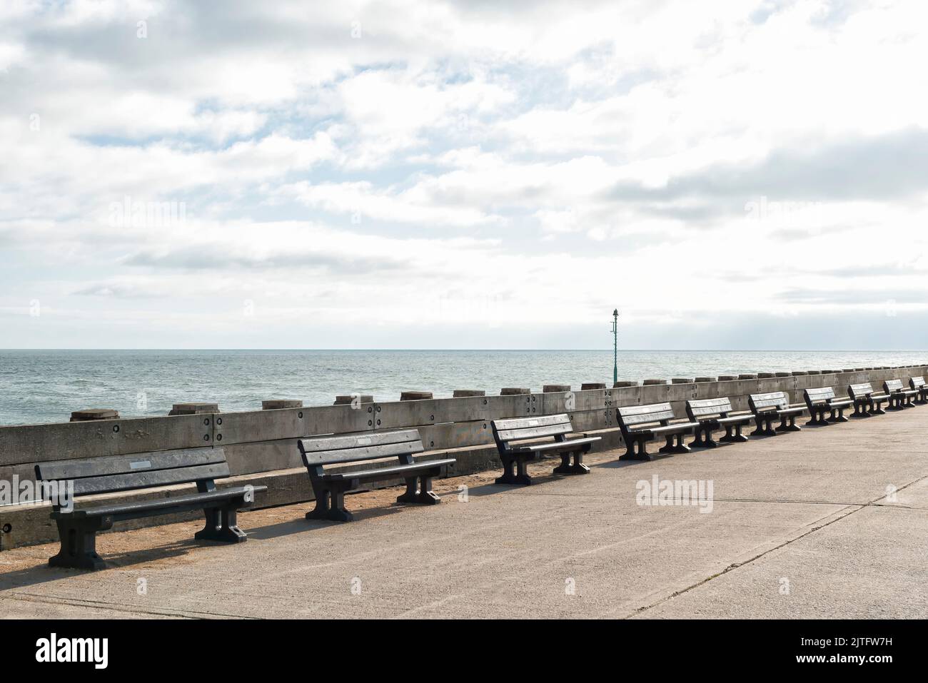 Benches along the harbour in West Bay Stock Photo - Alamy