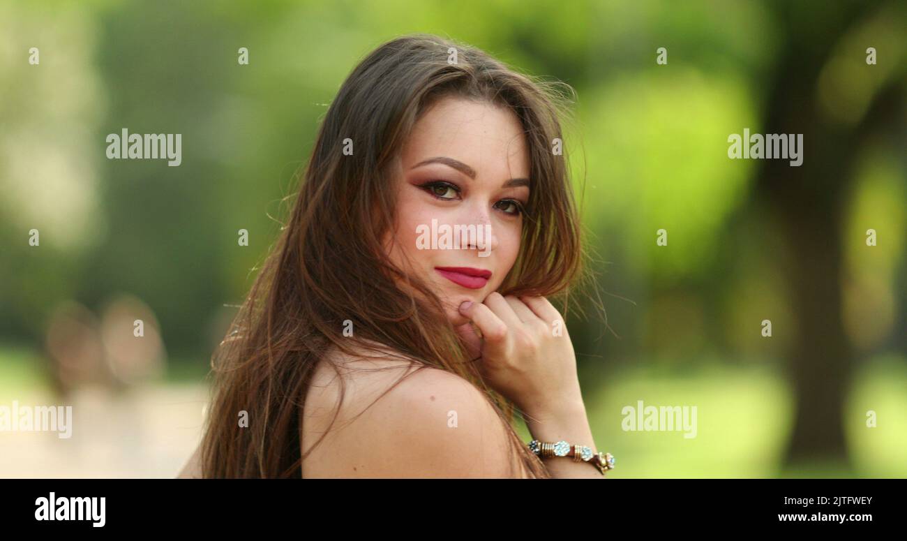 Pretty millennial girl posing in outdoor park nature Stock Photo - Alamy