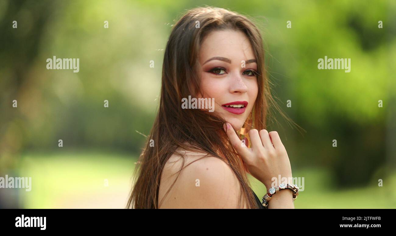 Pretty millennial girl posing in outdoor park nature Stock Photo - Alamy