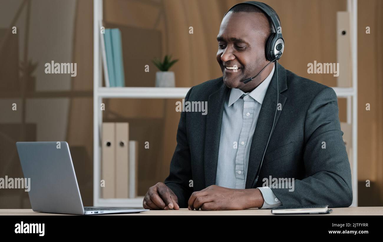 Elderly cheerful businessman African agent broker salesman old 50s man ...