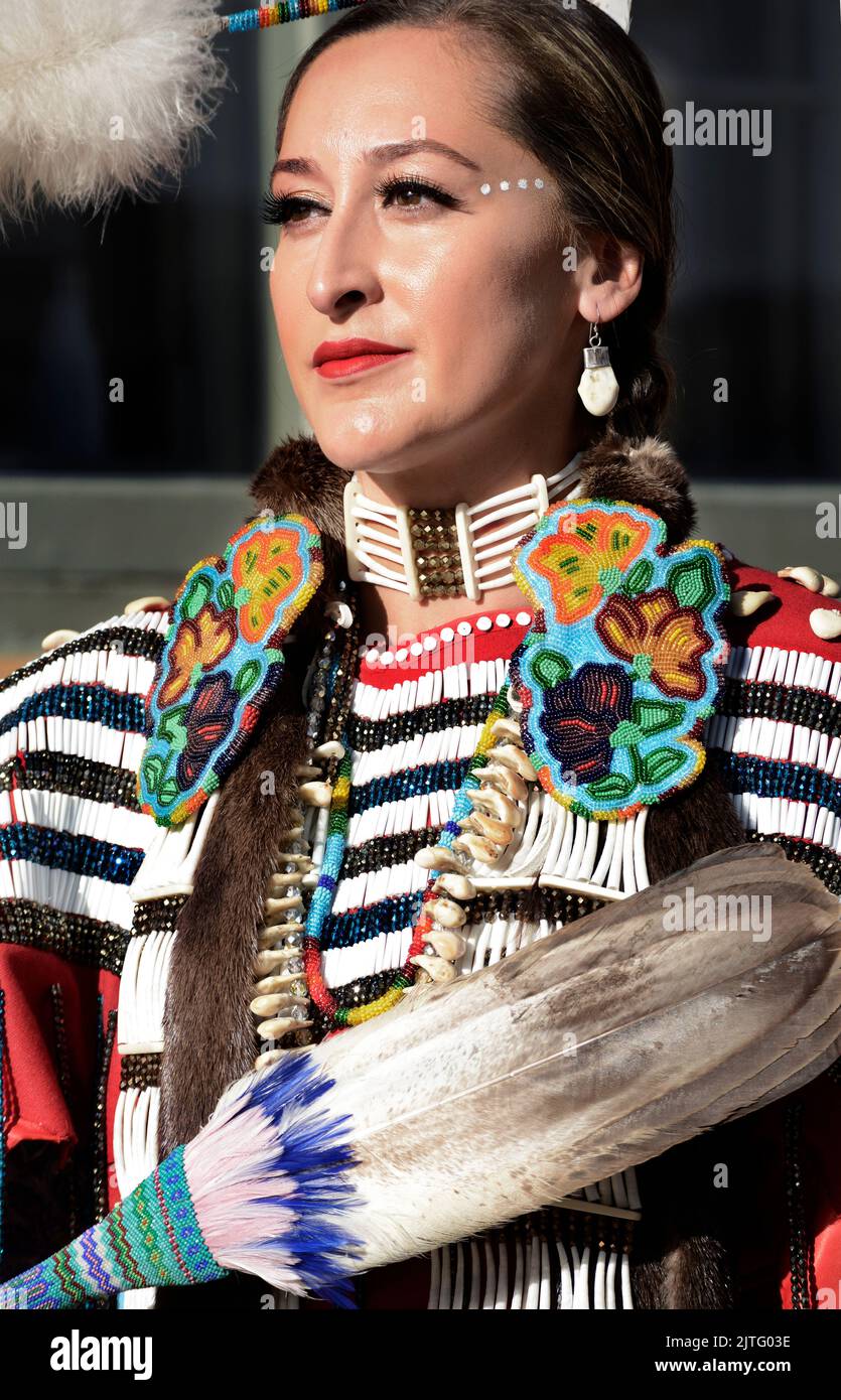 A Native American woman (see additional information) poses for photos ...