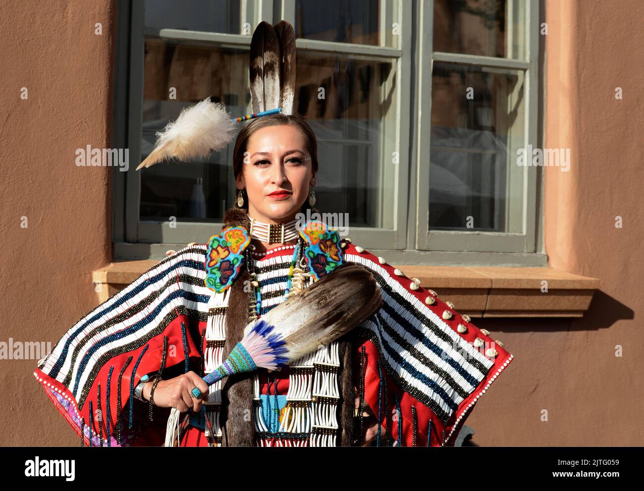 A Native American woman (see additional information) poses for photos ...