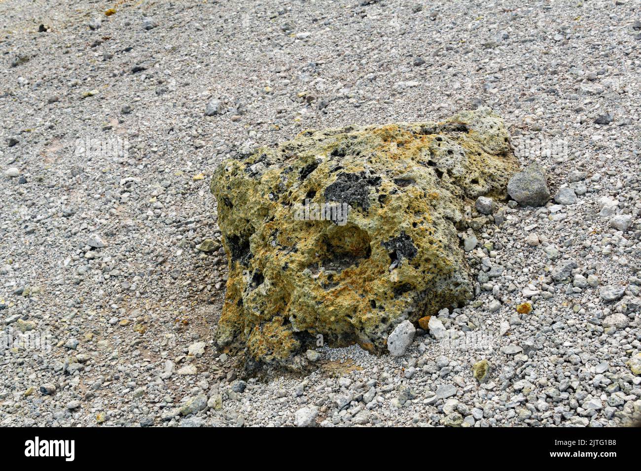 volcanic bomb among the tephra on the slope of the volcano close-up ...