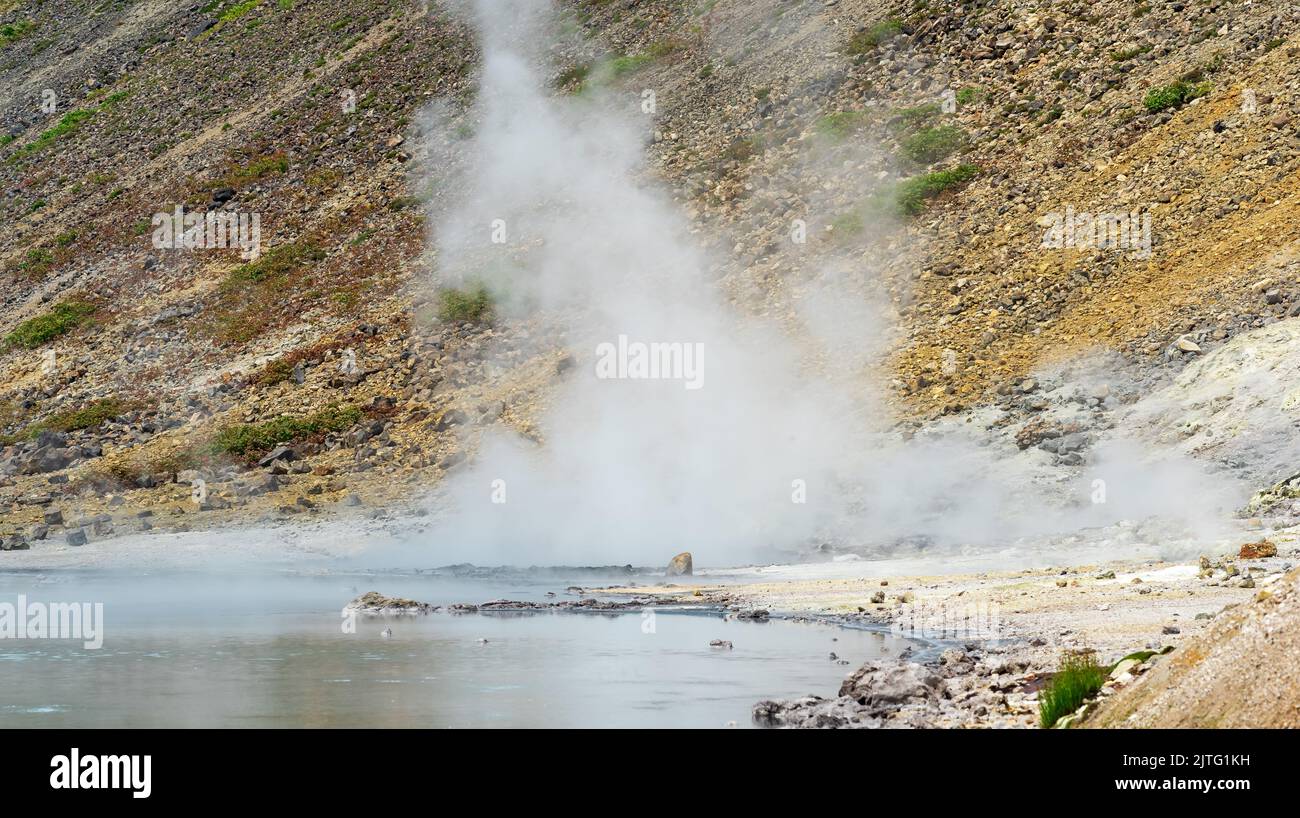 hot hydrothermal water outlet on the shore of the lake in the caldera ...