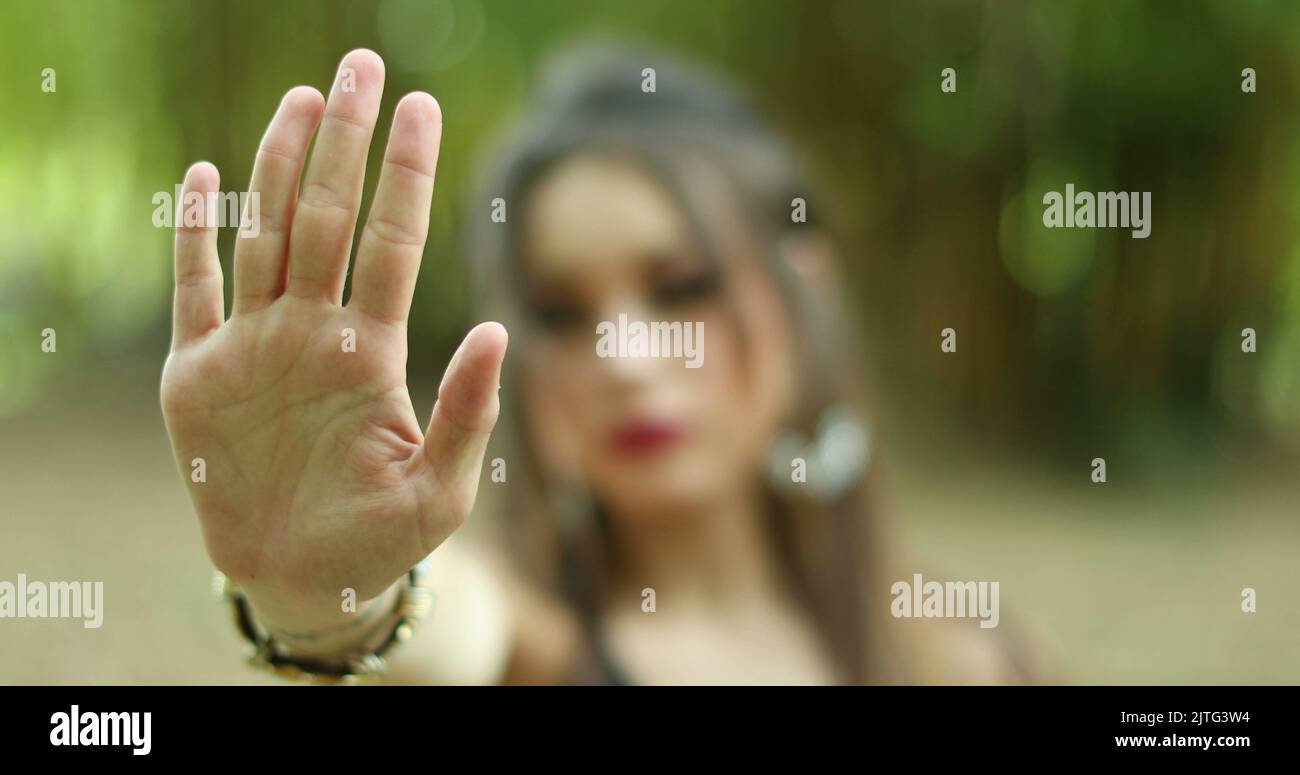 Woman holding arm and hand saying NO signaling to STOP Stock Photo - Alamy