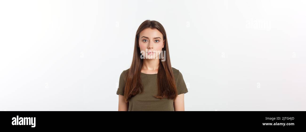 Portrait of a beautiful young woman looking at the camera and smiling ...