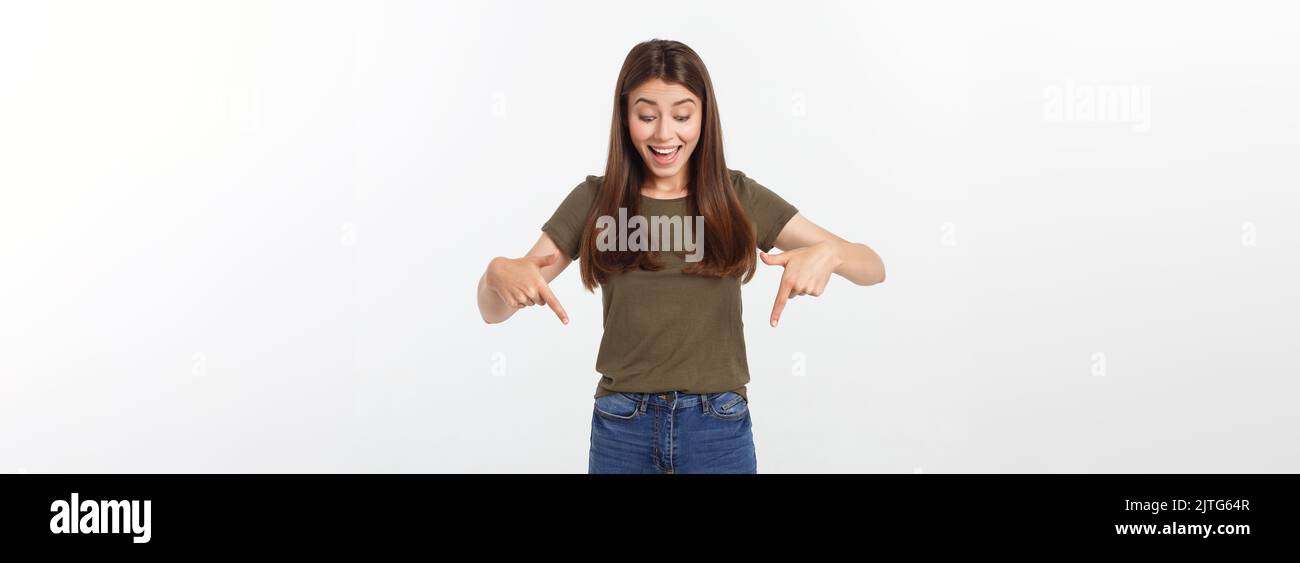 Beautiful young elegant woman over isolated background pointing hand ...