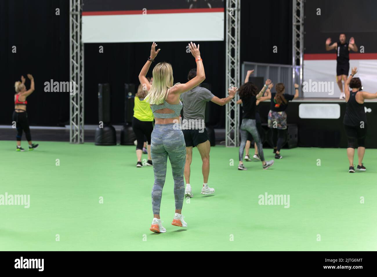 Fitness Workout In Gym Girls Doing Exercises In Class With Music And