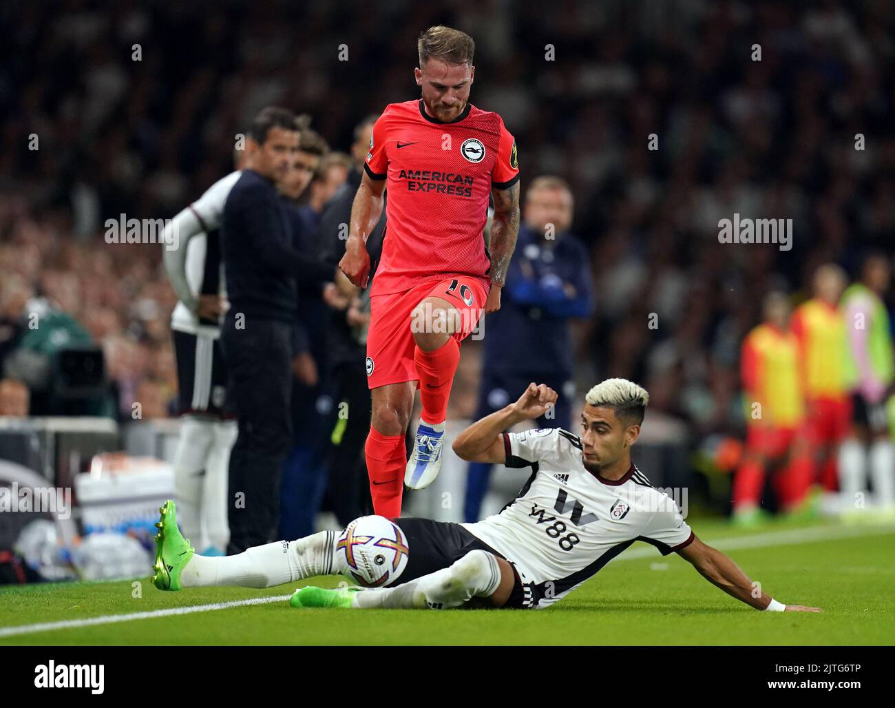 Brighton and Hove Albion's Alexis Mac Allister jumps the tackle from ...