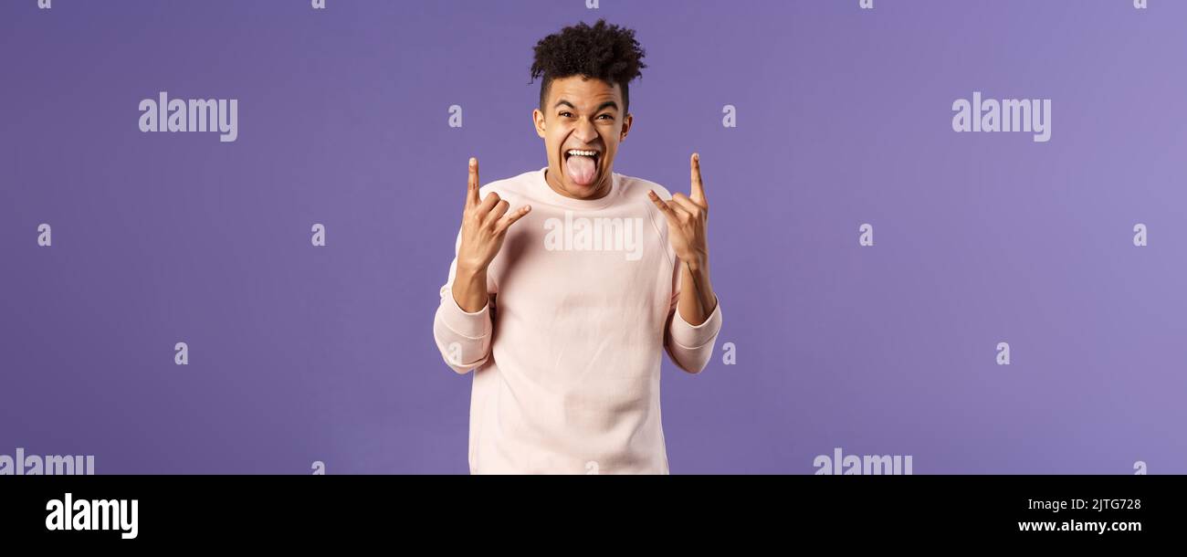 Portrait of enthusiastic, excited funny young man having fun, enjoying ...