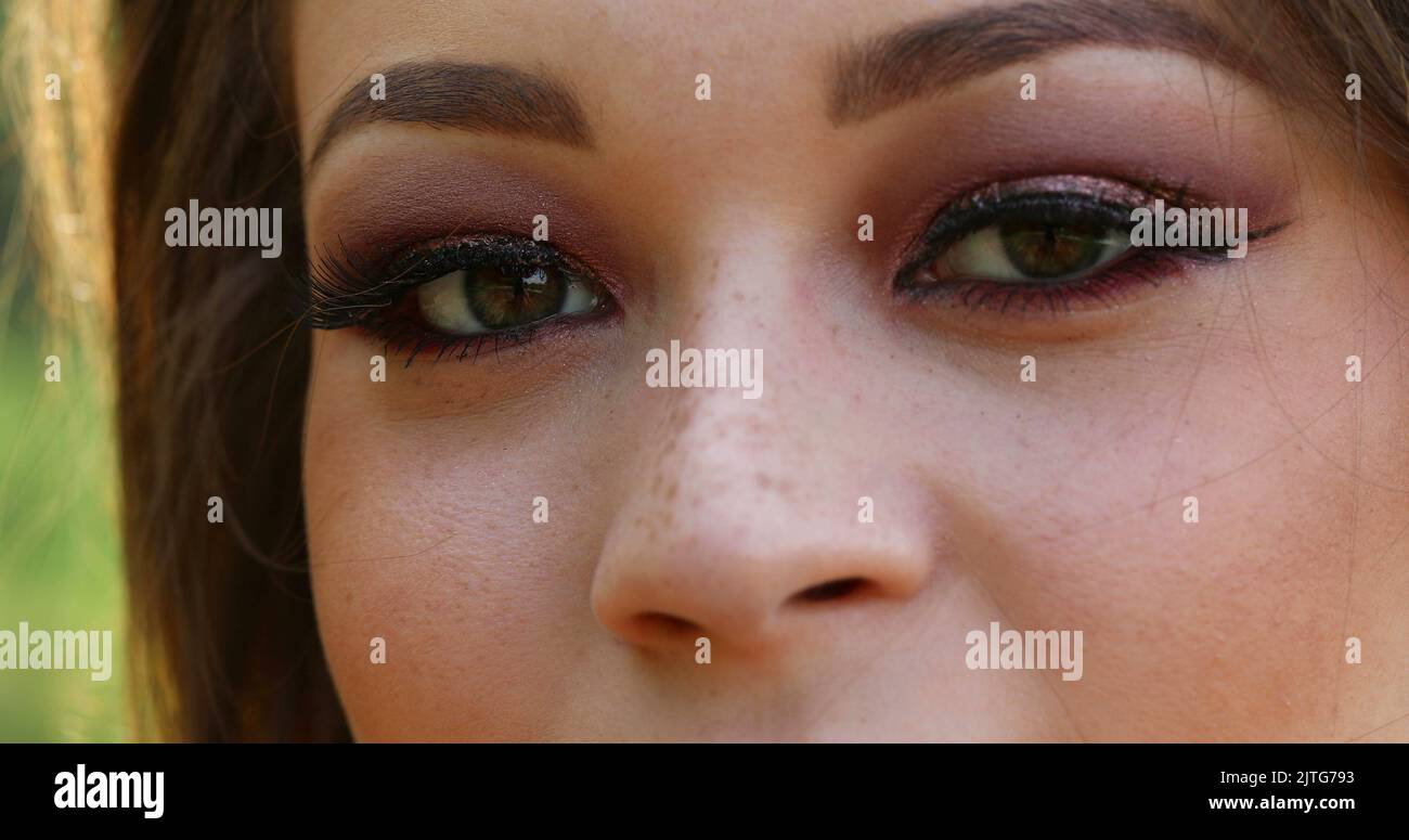 Woman macro closeup face opening eyes. Pretty millennial girl face ...