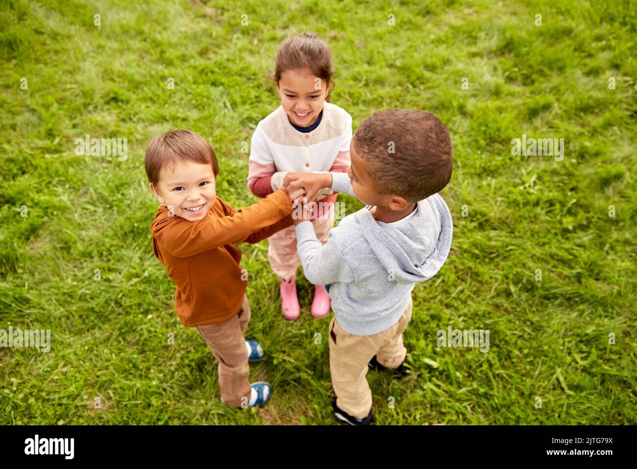 group of children playing game at park Stock Photo - Alamy