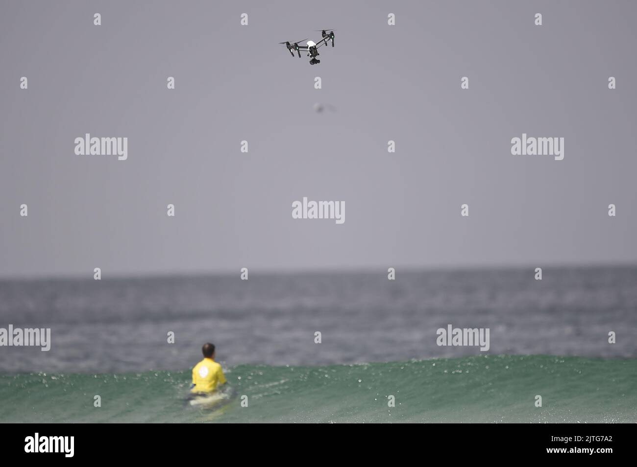 Drone hovering above Surfer Stock Photo - Alamy