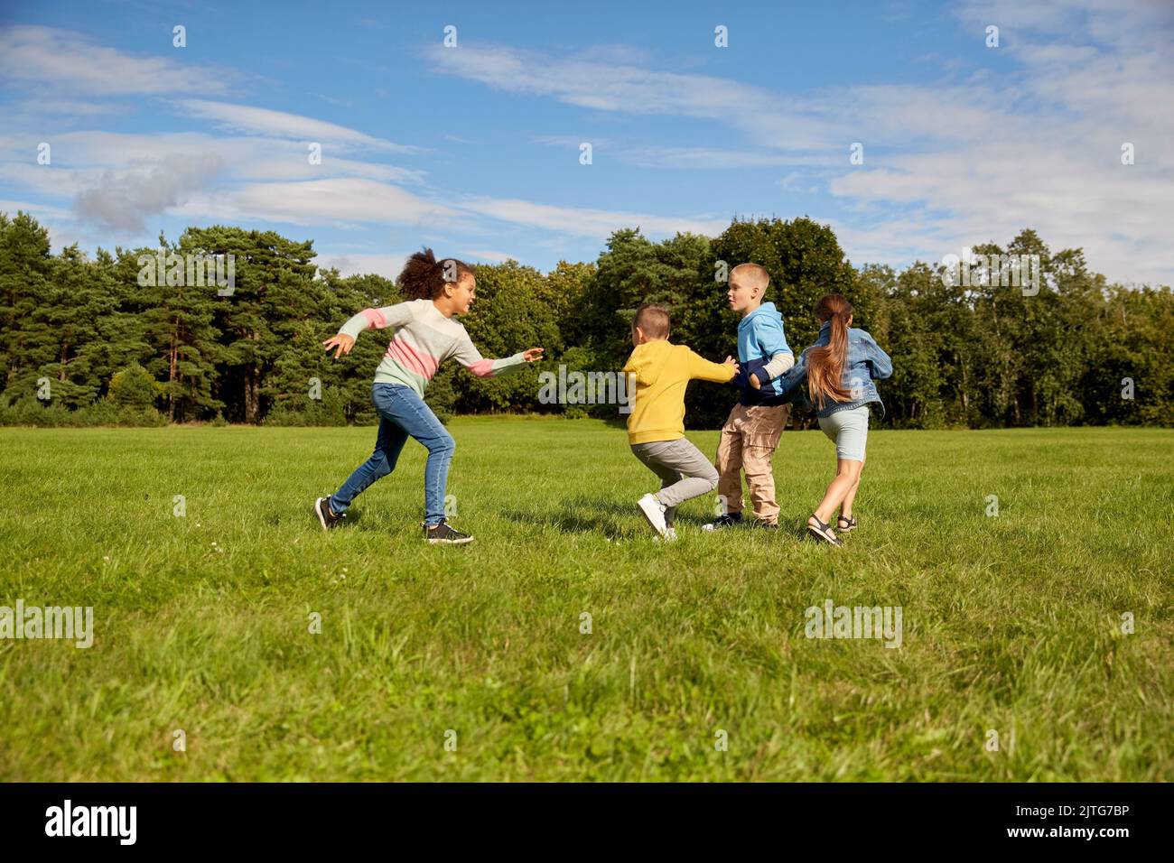 Children running field multiethnic hi-res stock photography and images ...