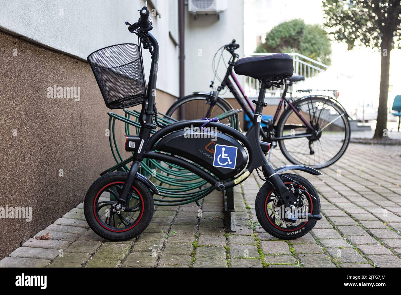 Disabled electric scooter with handicap icon on the side city Stock ...