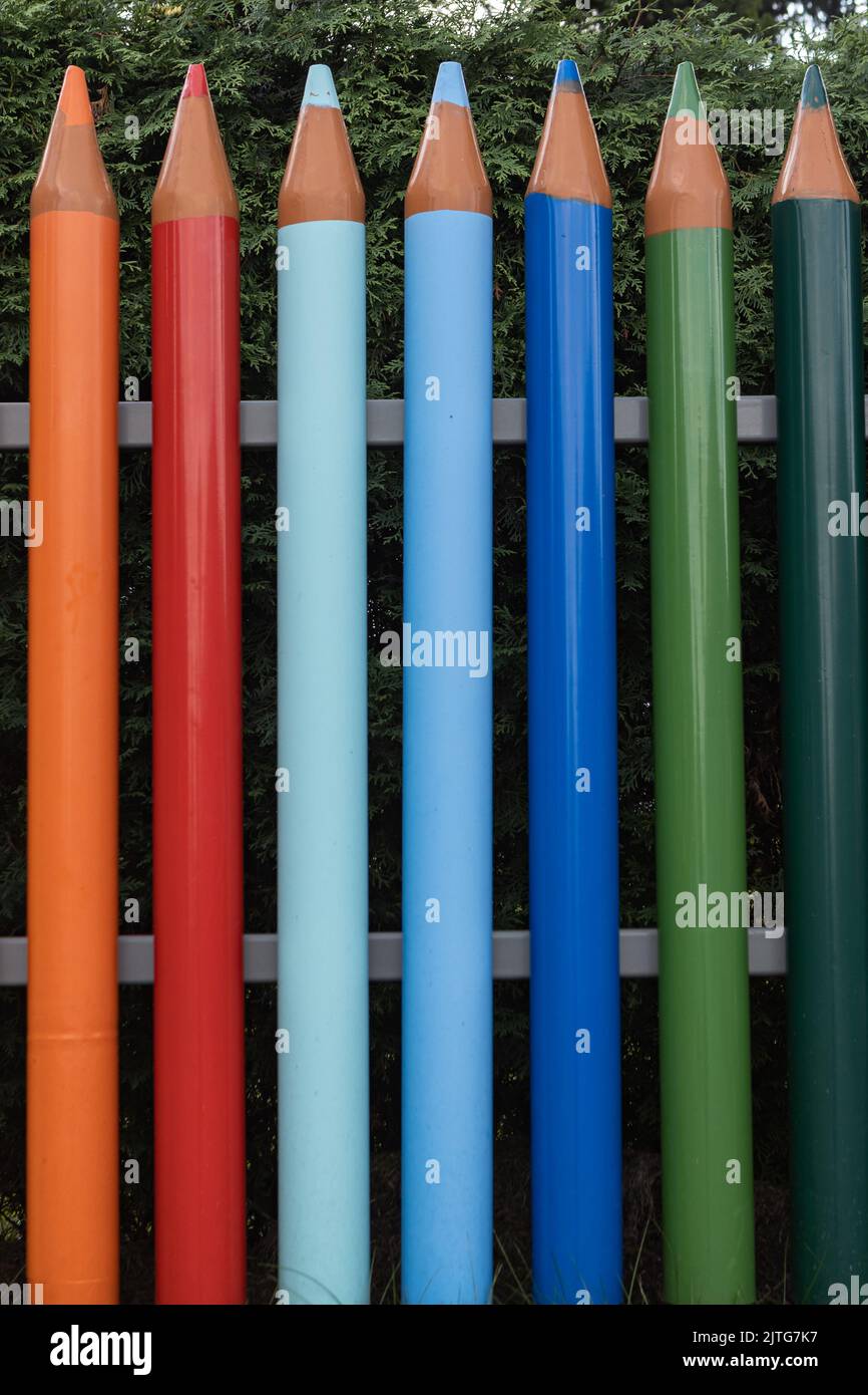 coloured pencil fence kindergarten school blue orange green Stock Photo ...