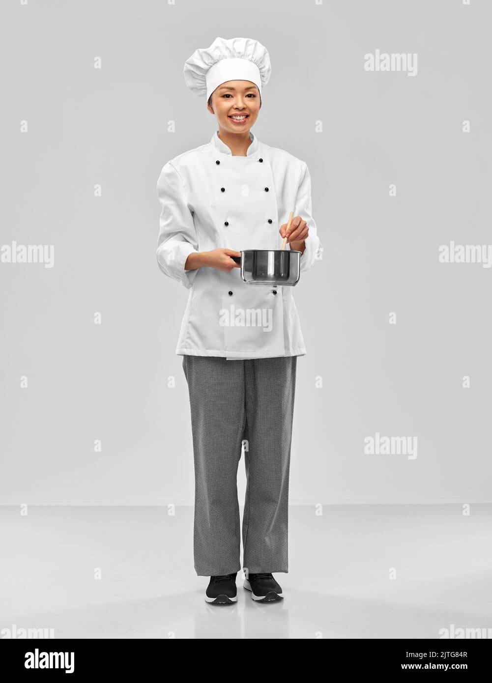 happy smiling female chef with saucepan Stock Photo - Alamy