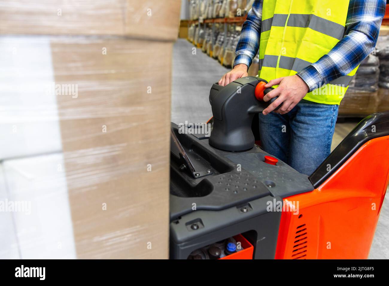 man operating forklift loader at warehouse Stock Photo - Alamy