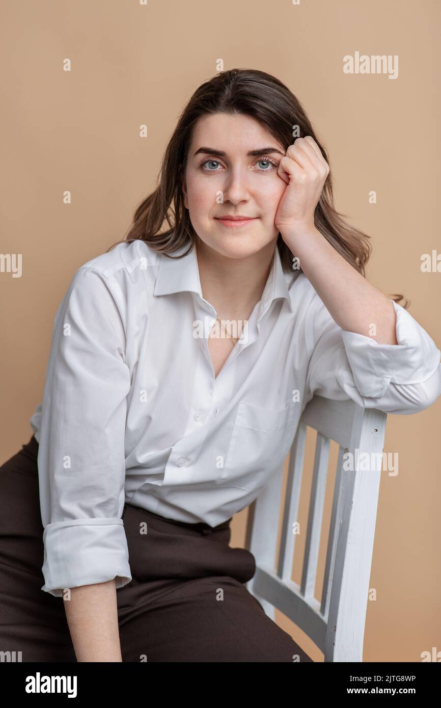 Woman sitting chair white pants hi-res stock photography and images - Alamy