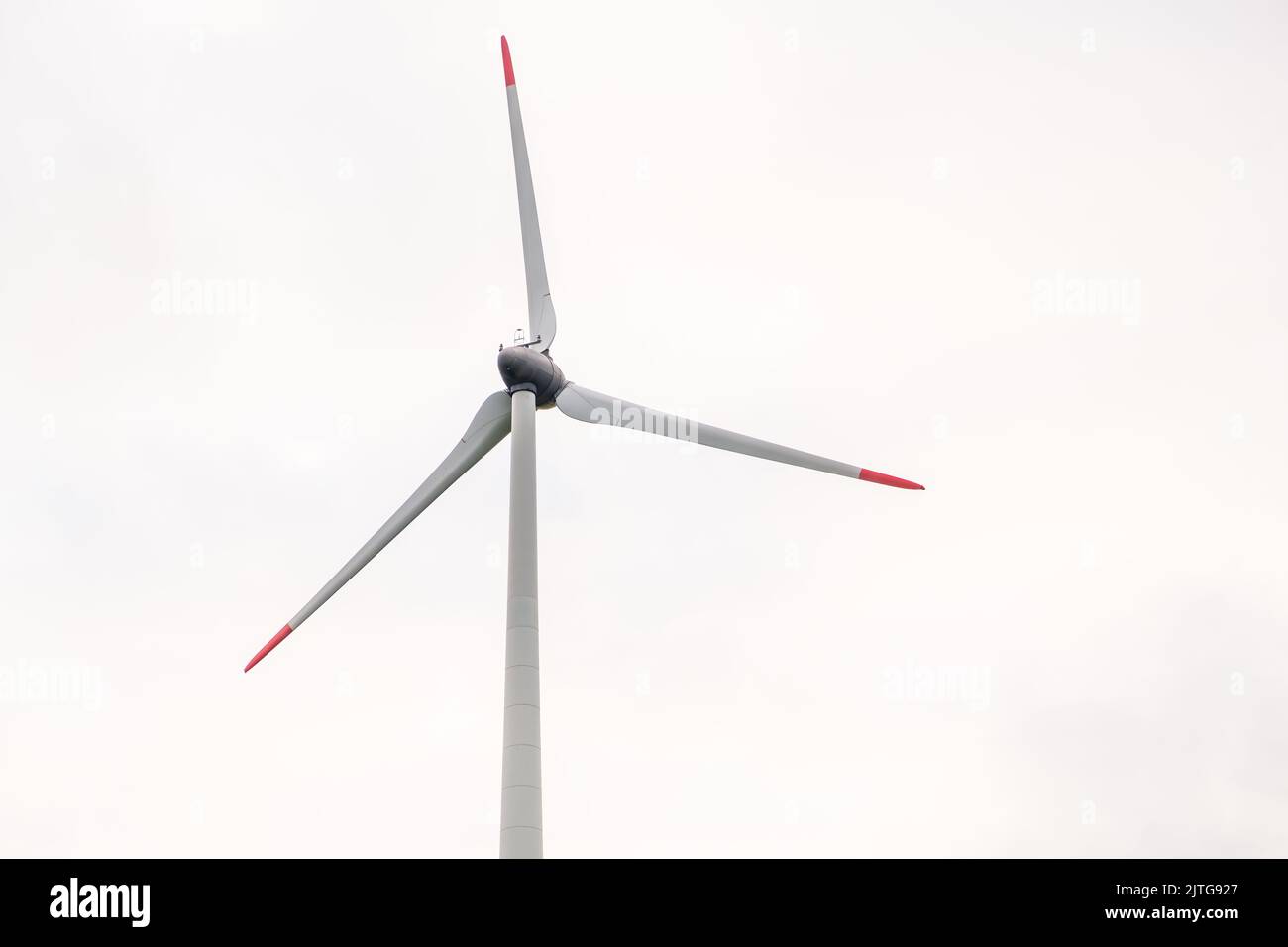 Windmill propeller against the grey sky. Generation of green energy ...