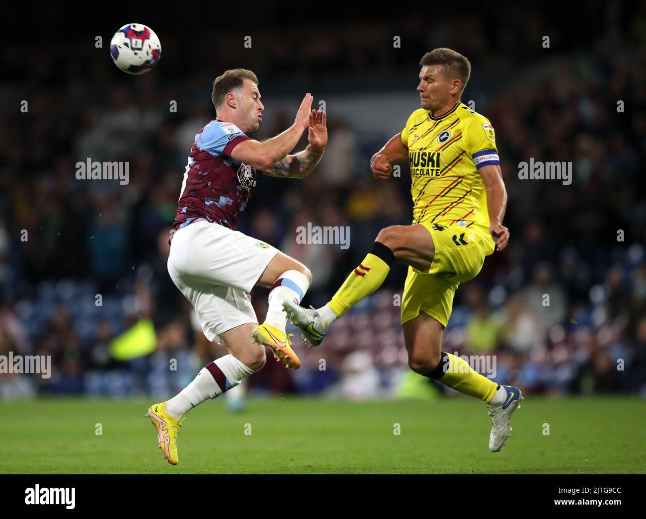 Burnley's Ashley Barnes (left) an Millwall's Shaun Hutchinson battle ...