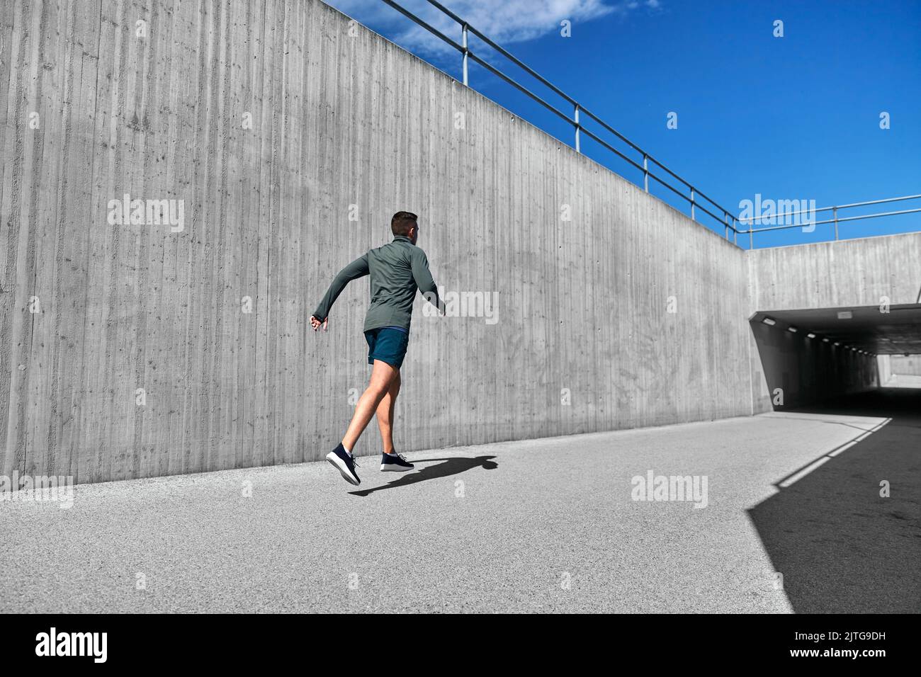 Back view young sportsman running hi-res stock photography and images ...