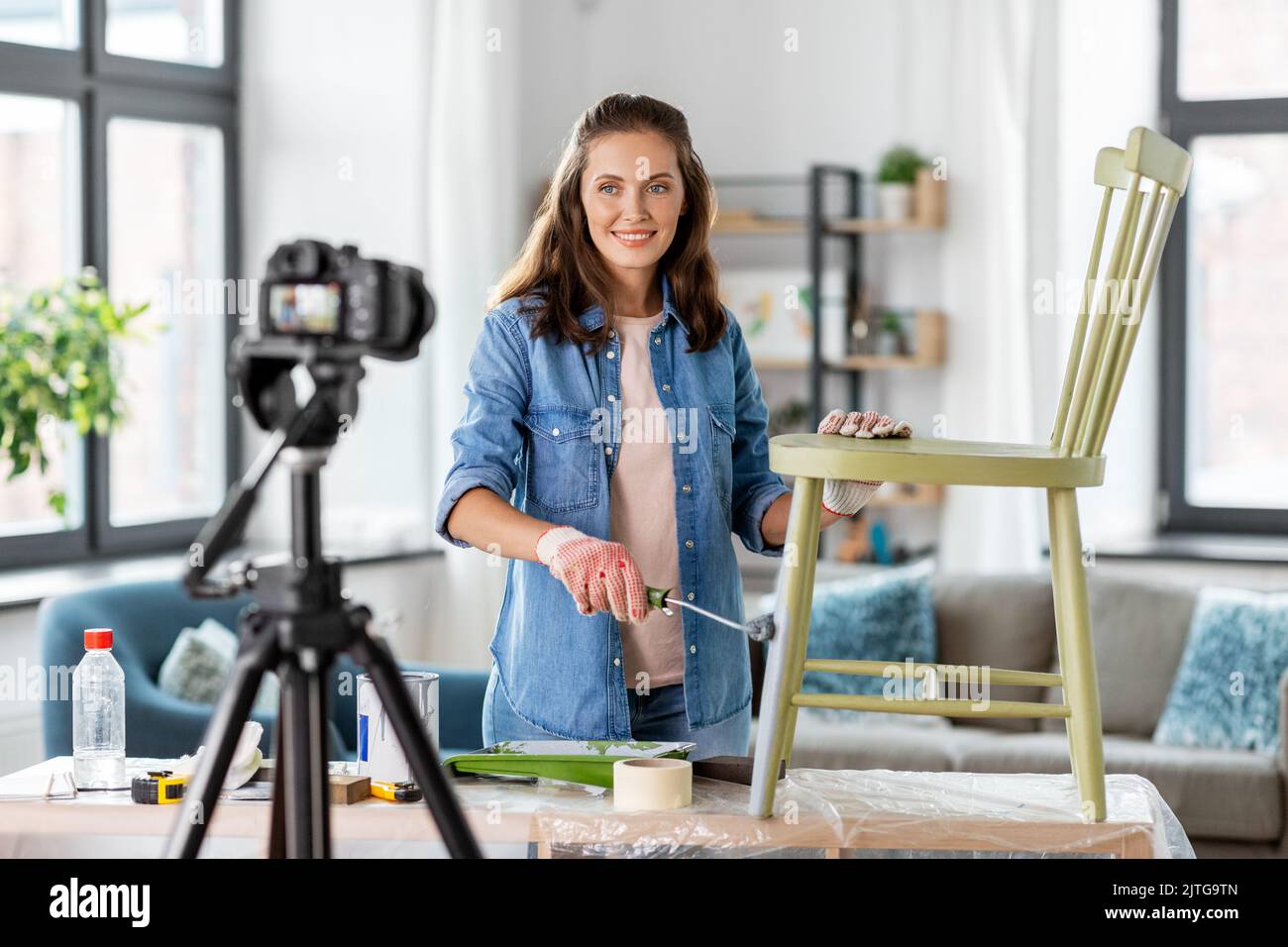 woman or blogger showing old chair renovation Stock Photo - Alamy
