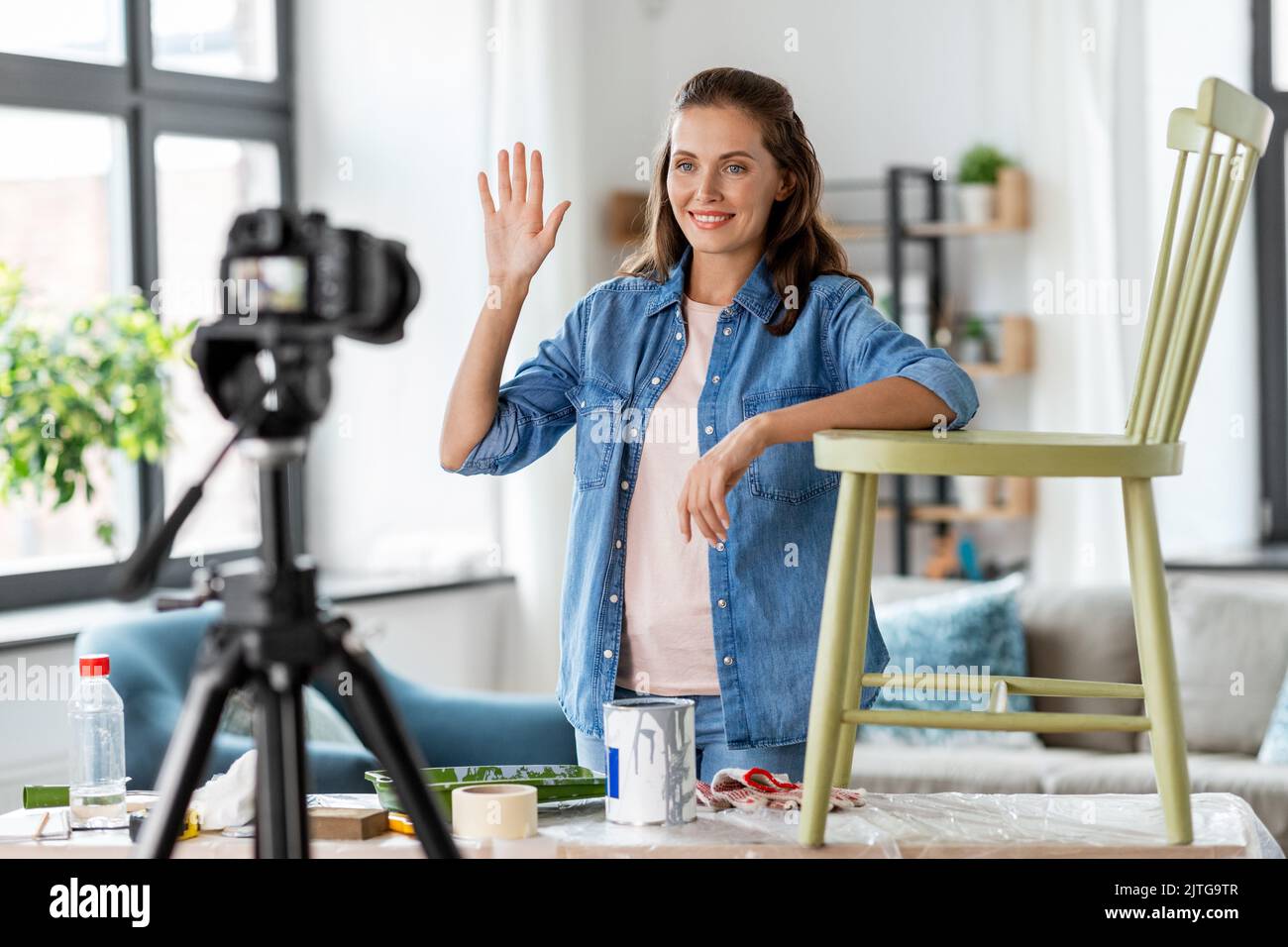 woman or blogger showing old chair renovation Stock Photo - Alamy