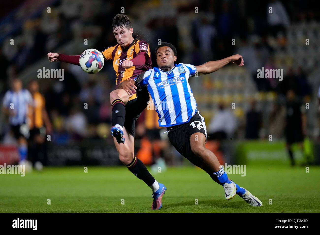 Matty Foulds #14 of Bradford City and Leojo Davidson of Sheffield ...