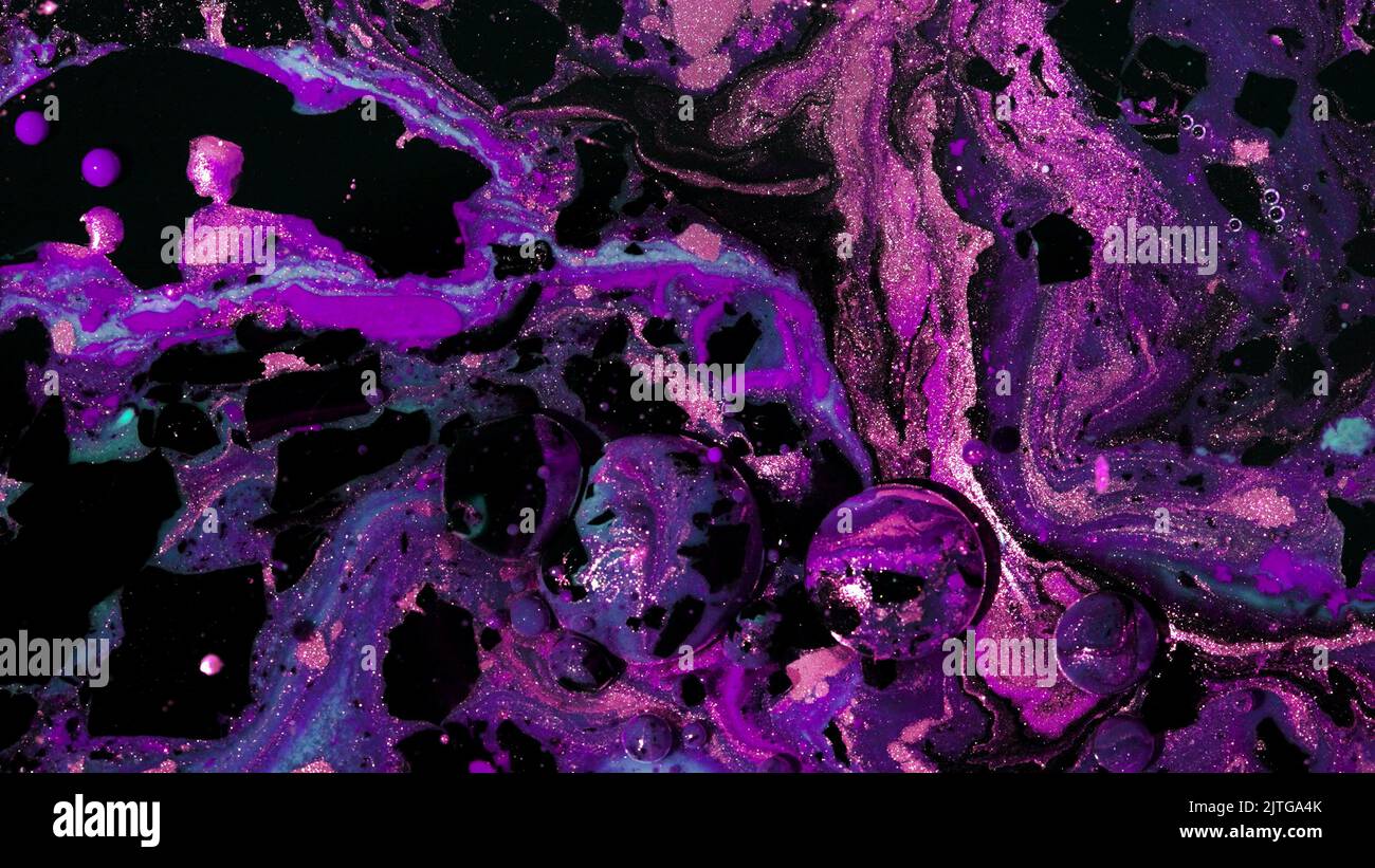 Abstract marble liquid glitter paint moving. Dark and purple pearl inks ...
