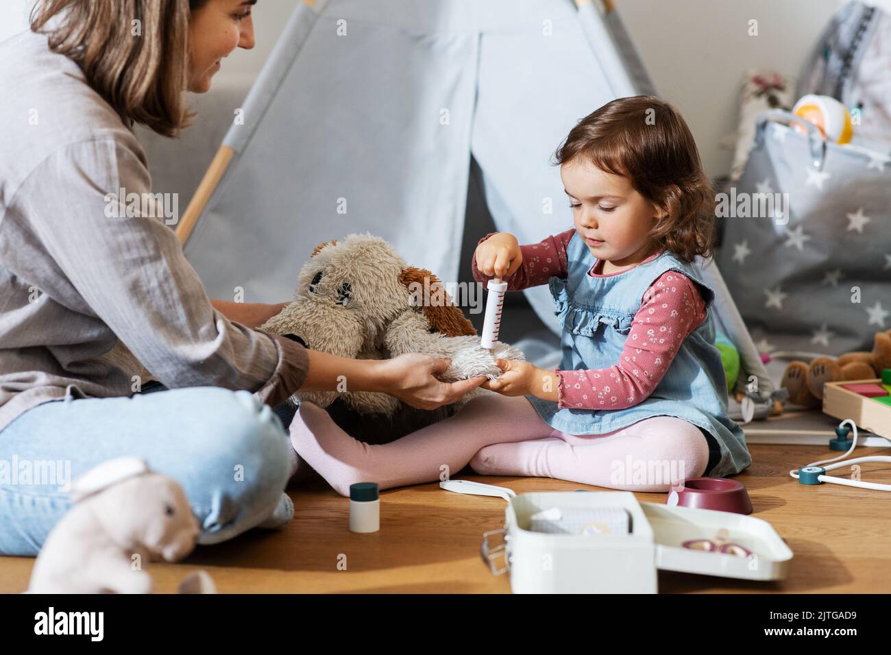 mother and daughter playing doctor at home Stock Photo - Alamy