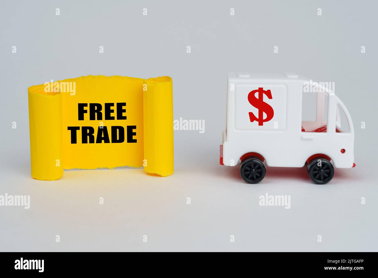 Business concept. On a white surface, a typewriter and a yellow paper ...