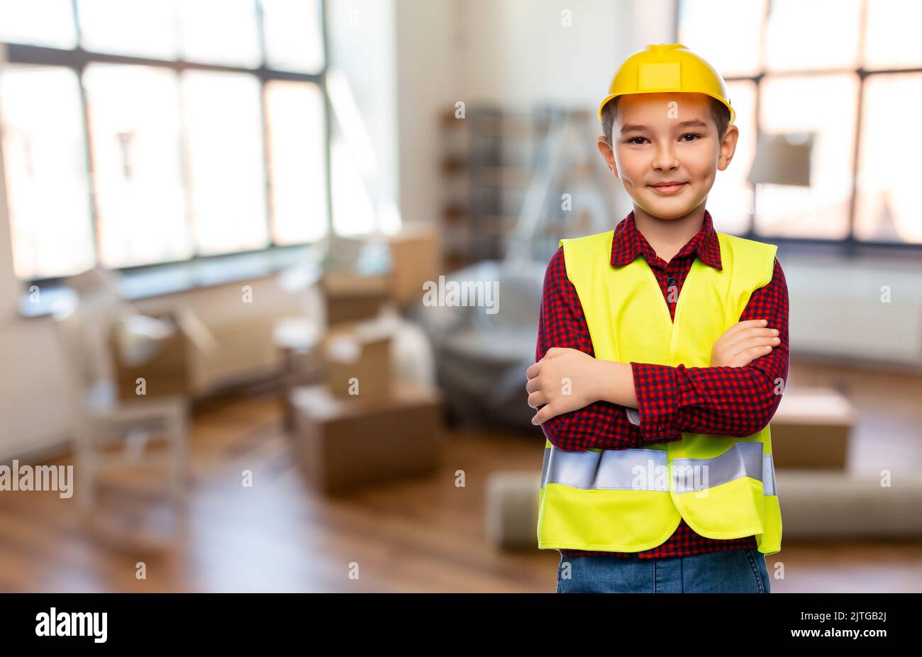 little boy in protective helmet and safety vest Stock Photo - Alamy