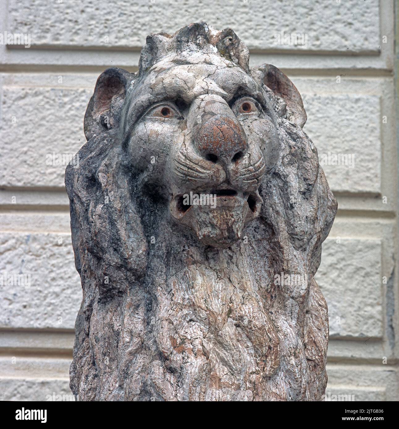 Close up of a old lion scuplutre garding the entrance to the royal ...