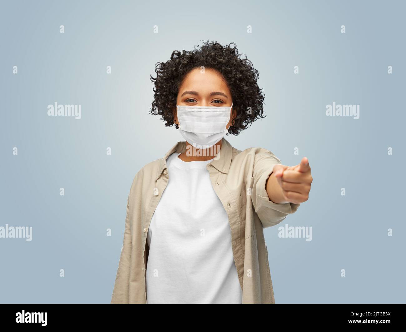 woman in medical mask pointing finger to camera Stock Photo - Alamy