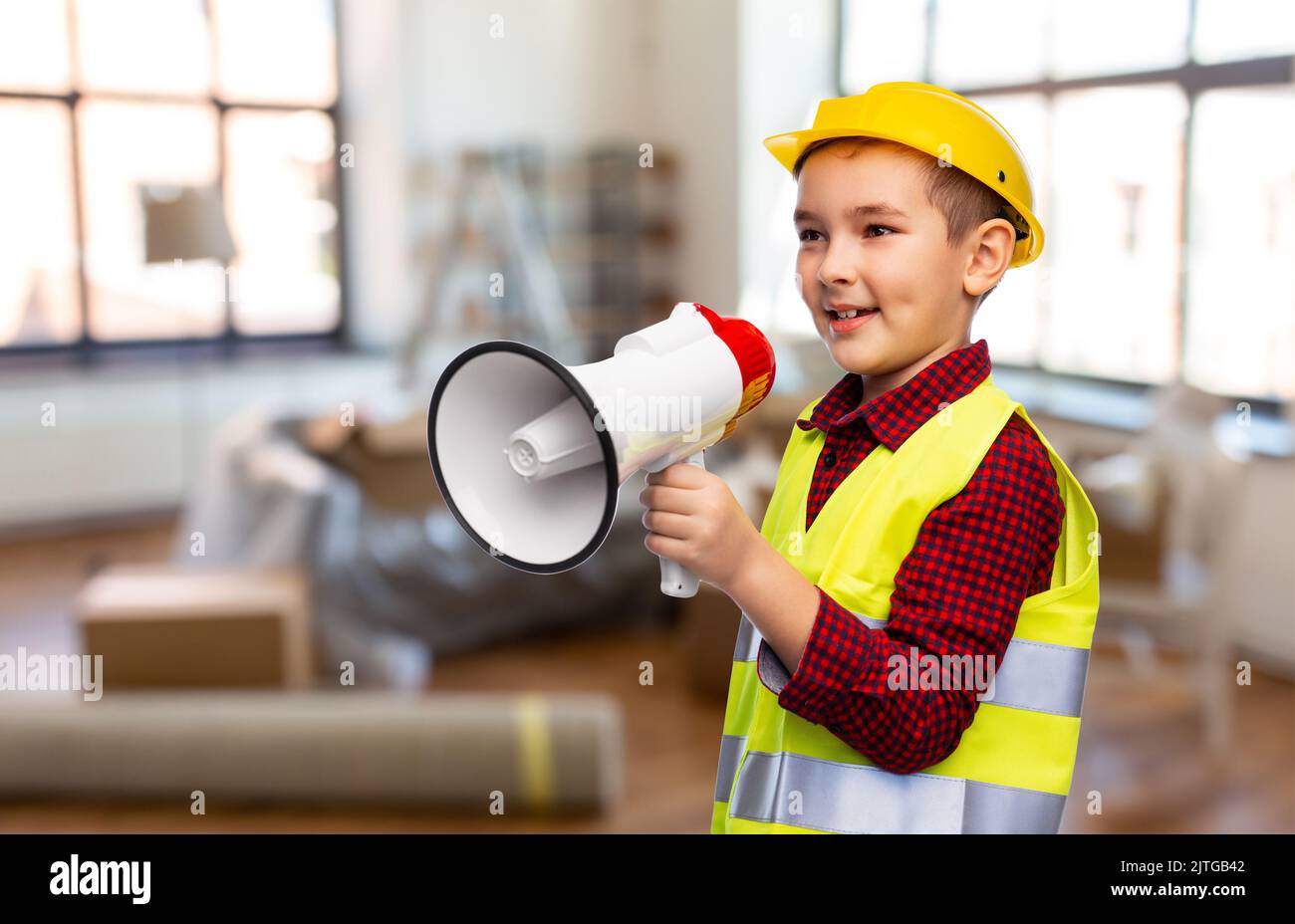 boy in protective helmet talking to megaphone Stock Photo - Alamy