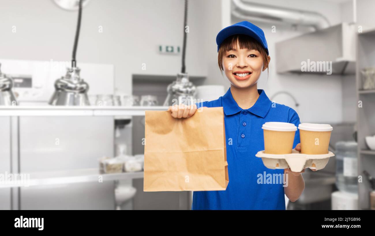 delivery woman with takeaway food and drinks Stock Photo - Alamy
