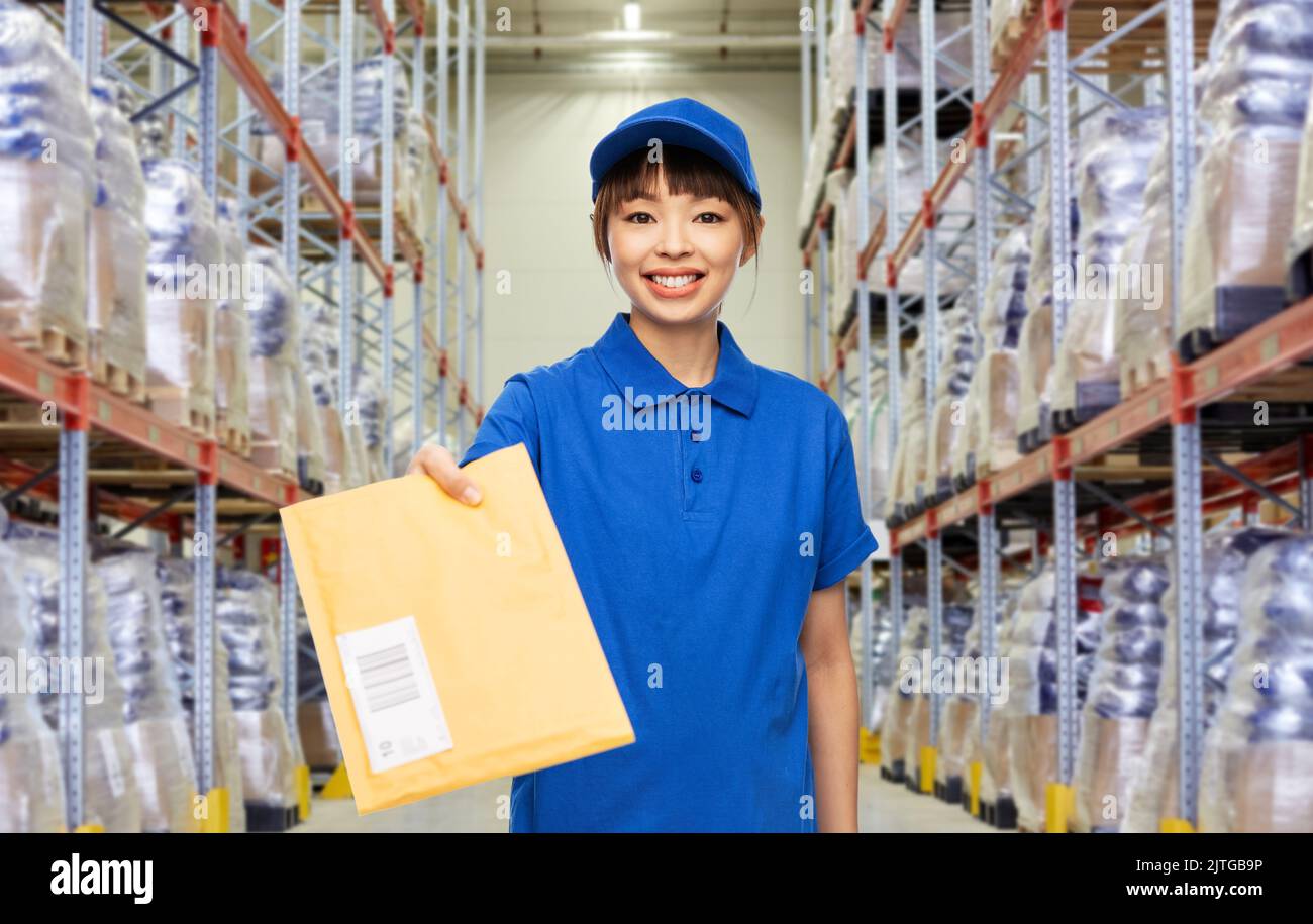 happy delivery woman holding parcel envelope Stock Photo - Alamy