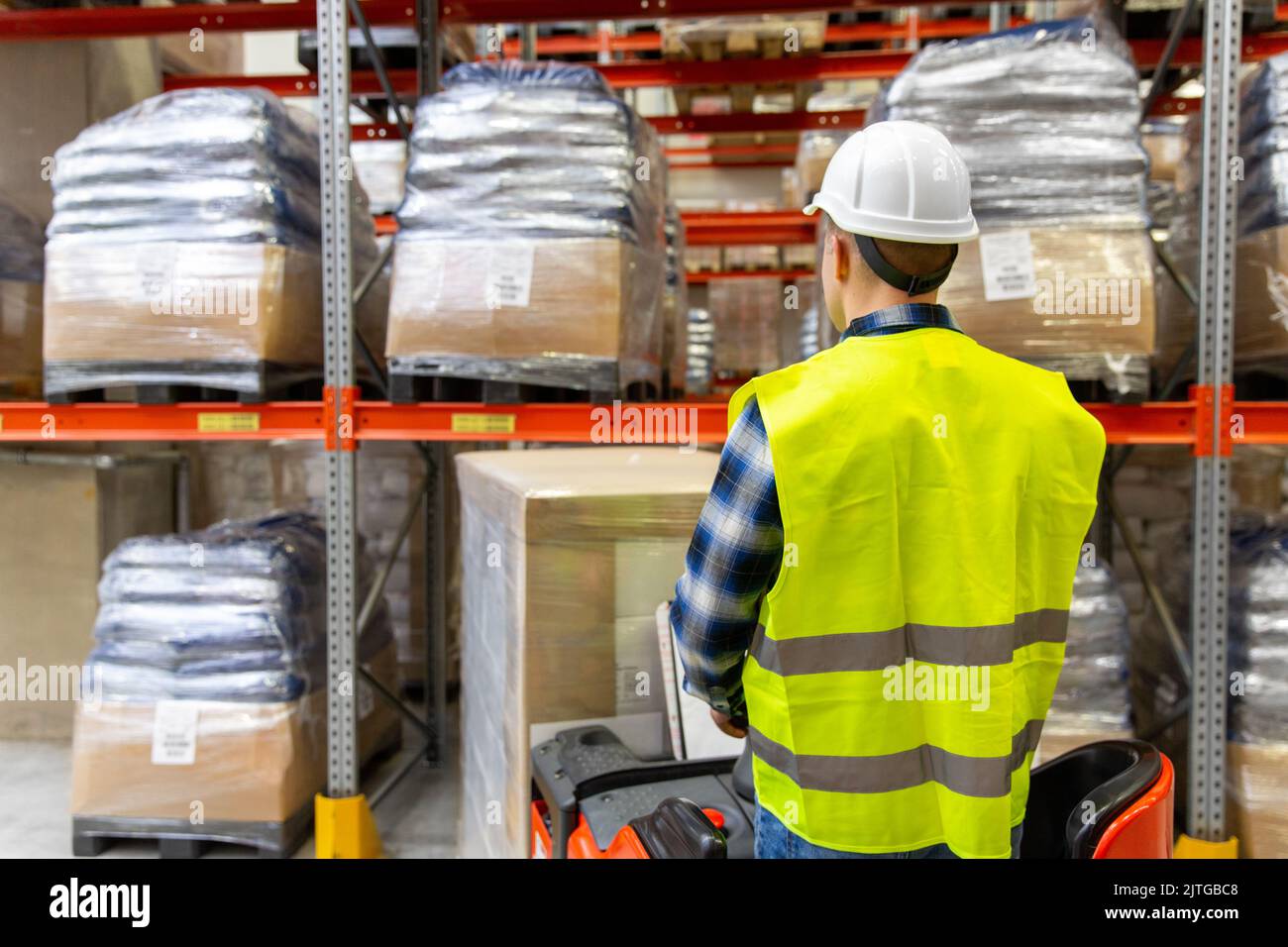 loader operating forklift at warehouse Stock Photo - Alamy