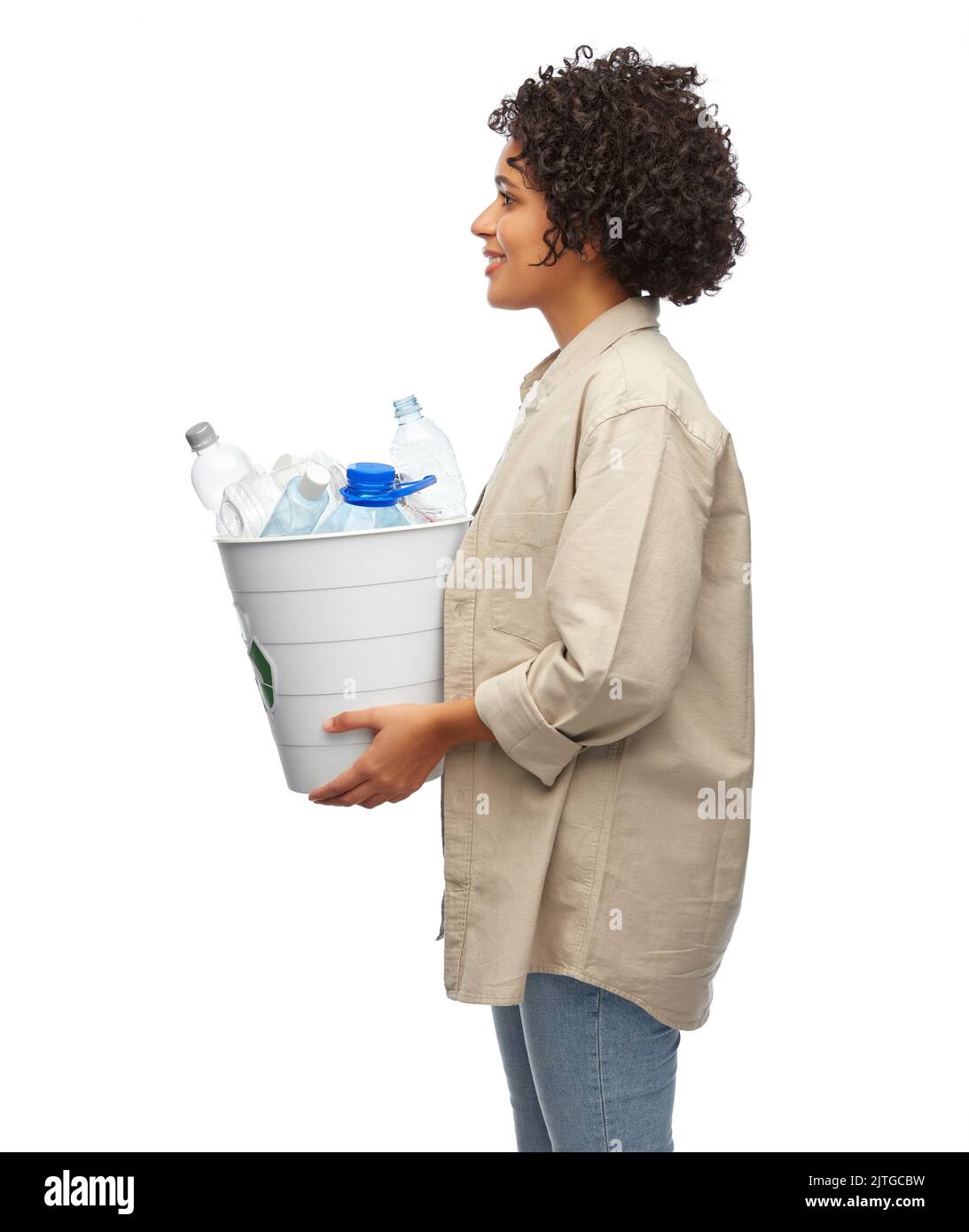 smiling young woman sorting plastic waste Stock Photo - Alamy
