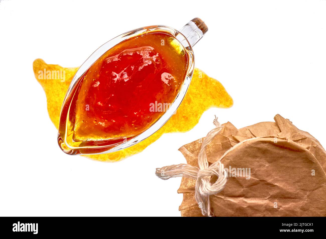 Orange color sweet fruit jam in glass bowl and jar isolated on white ...