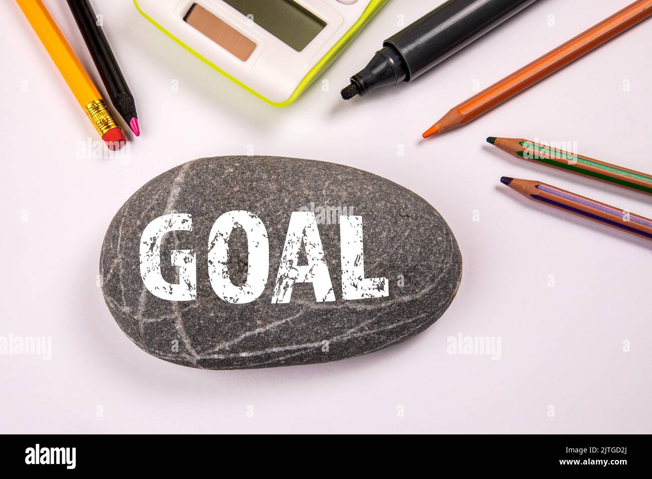 GOAL concept. Gray stone on a white office desk Stock Photo - Alamy
