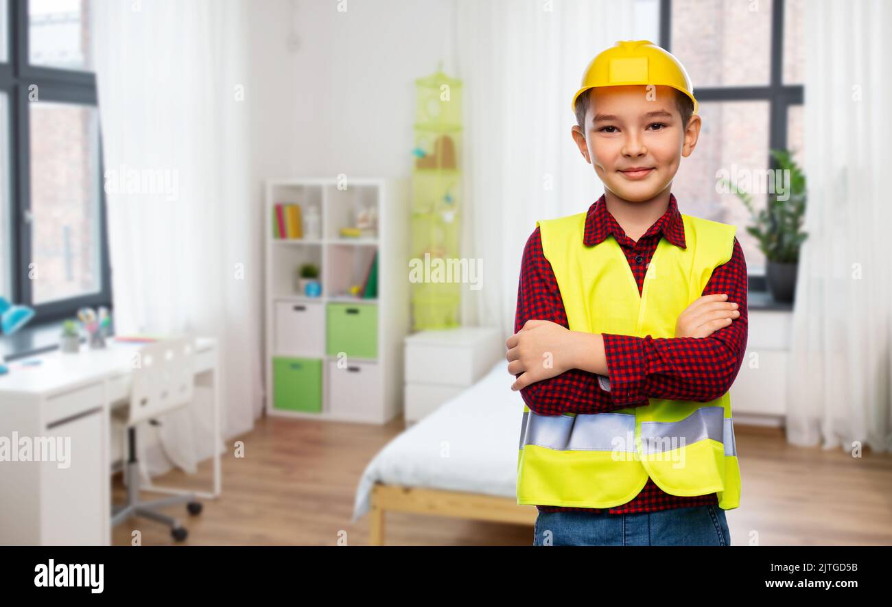 little boy in protective helmet and safety vest Stock Photo - Alamy