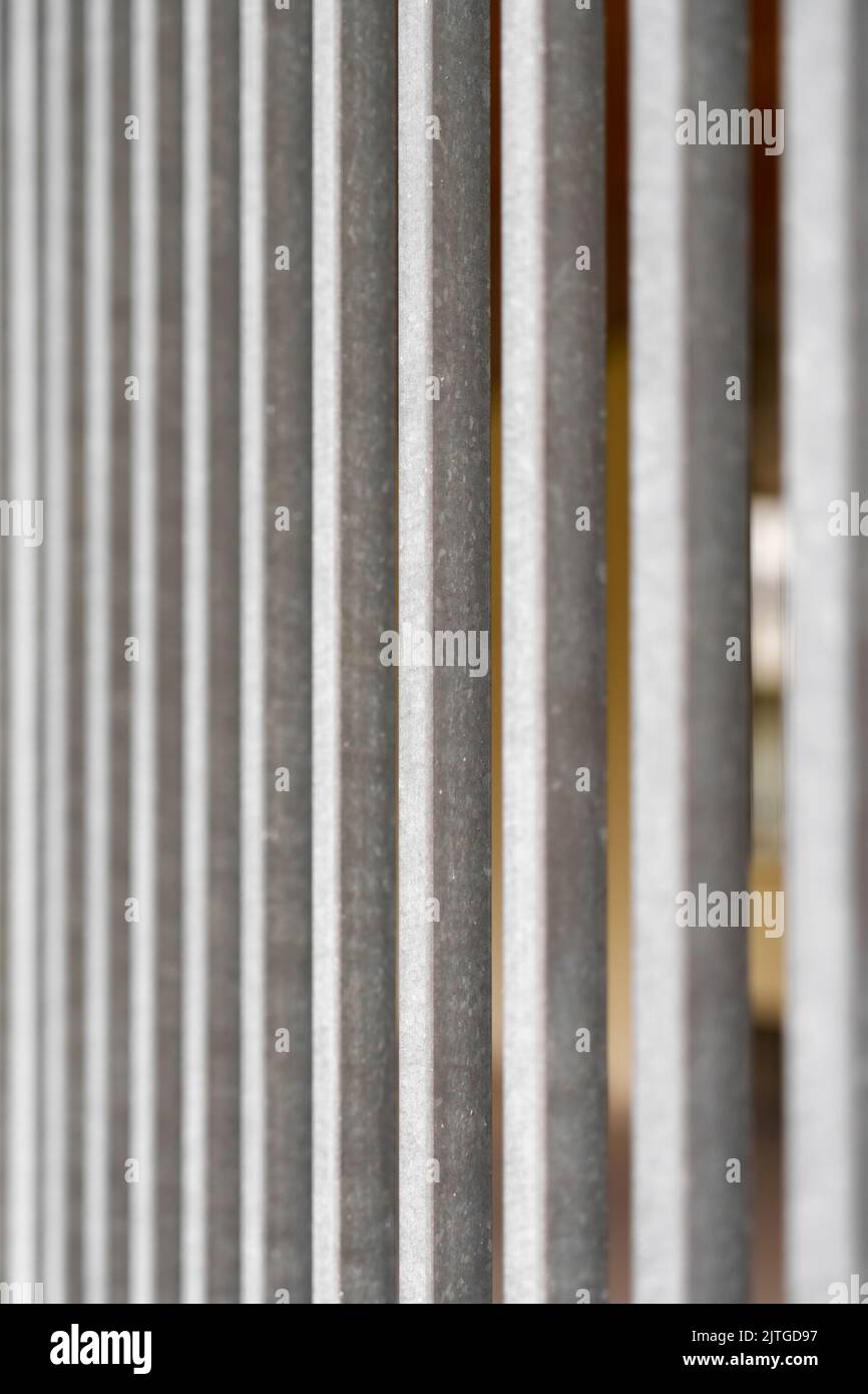 Parallel vertical geometric lines of a galvanized house yard fence ...