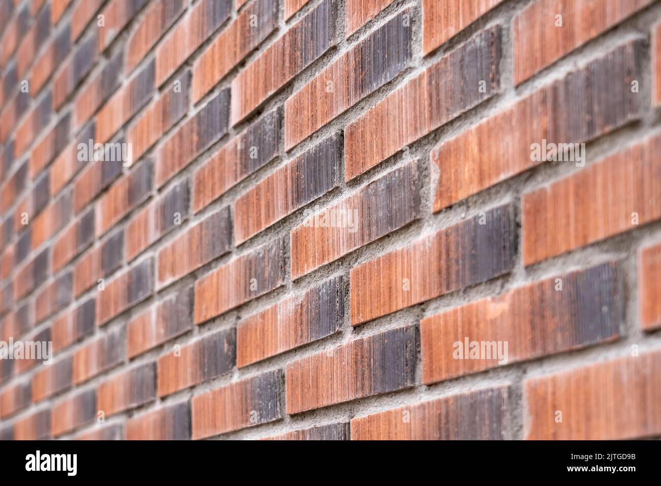 Brick red wall with uneven texture. Exterior decorative rough surface ...