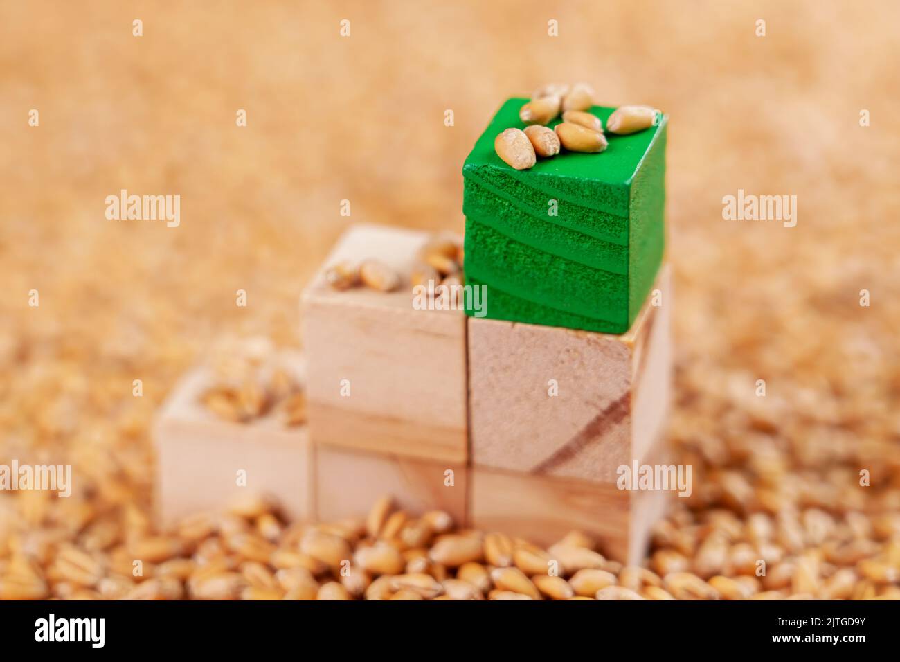 Food business concept. A tower of wooden toy blocks with a green block ...
